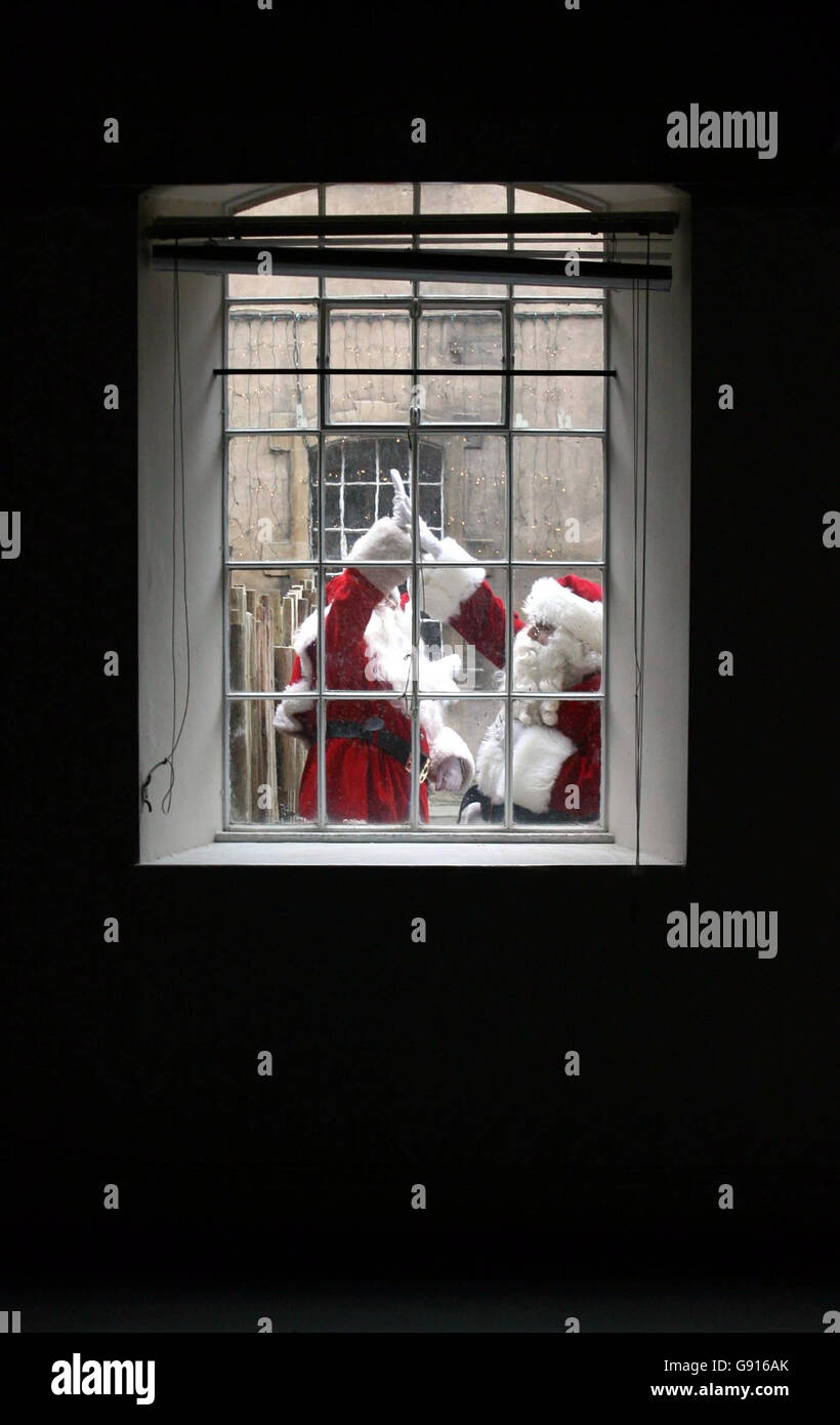 Santas seen through the square(ish) window during a gathering at Wookey ...