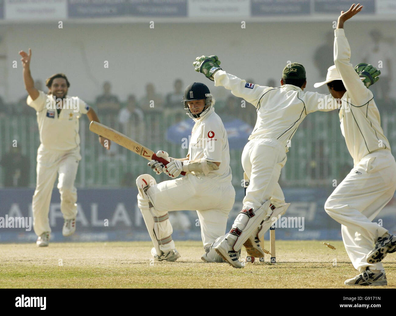 England's Matthew Hoggard looks back after playing on to his own stumps from the bowling of ...