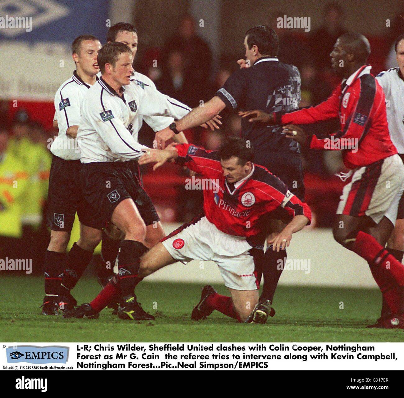 L-R; Chris Wilder, Sheffield United clashes with Colin Cooper ...