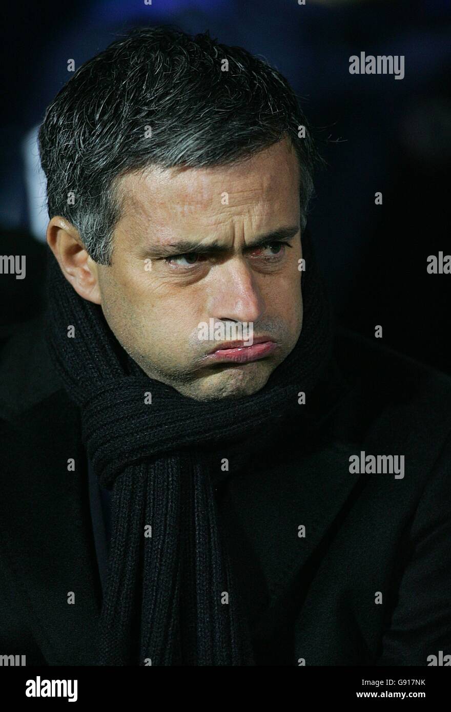 Chelseas manager jose mourinho feels the cold at fratton park hi-res ...