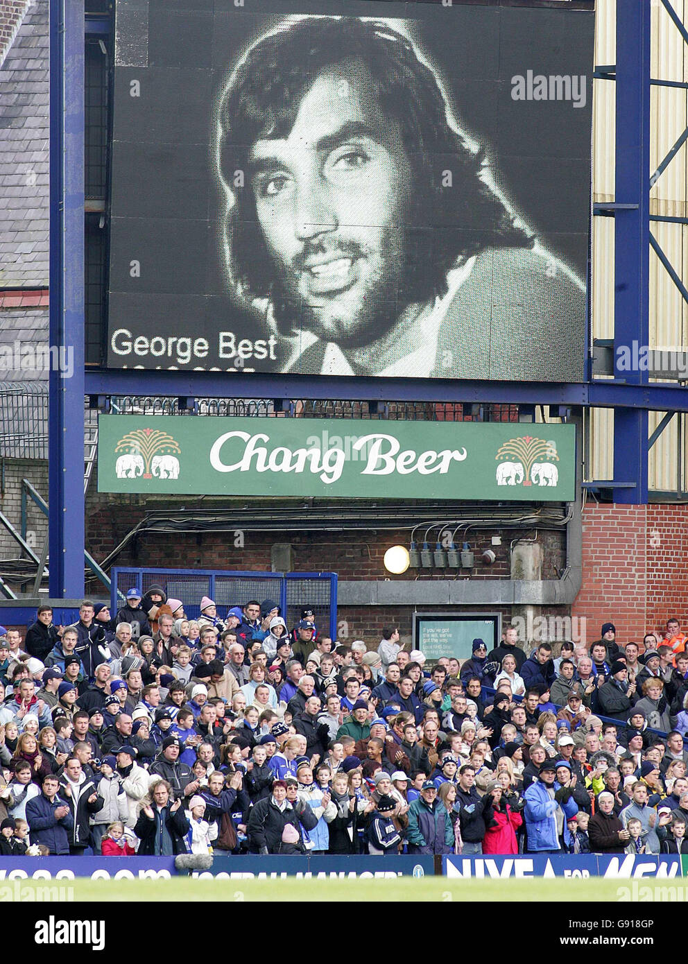 A large screen image of George Best is shown during the minute applause ...
