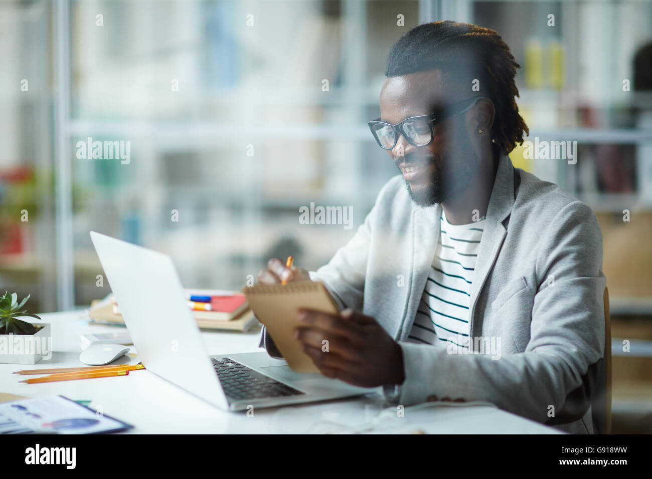 African man making notes hi-res stock photography and images - Alamy