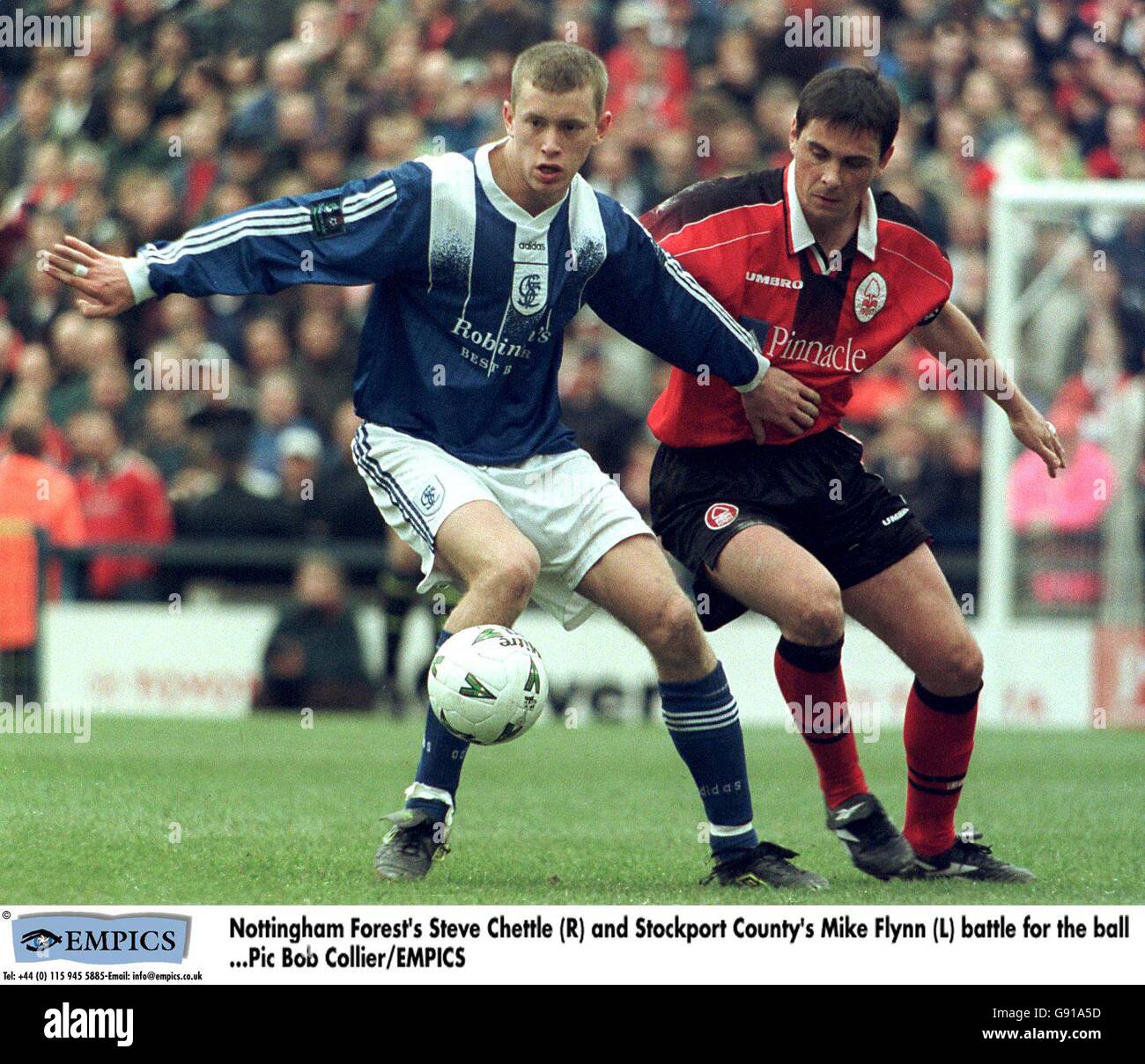 Stockport County's Aaron Wilbraham (left) shields the ball from ...