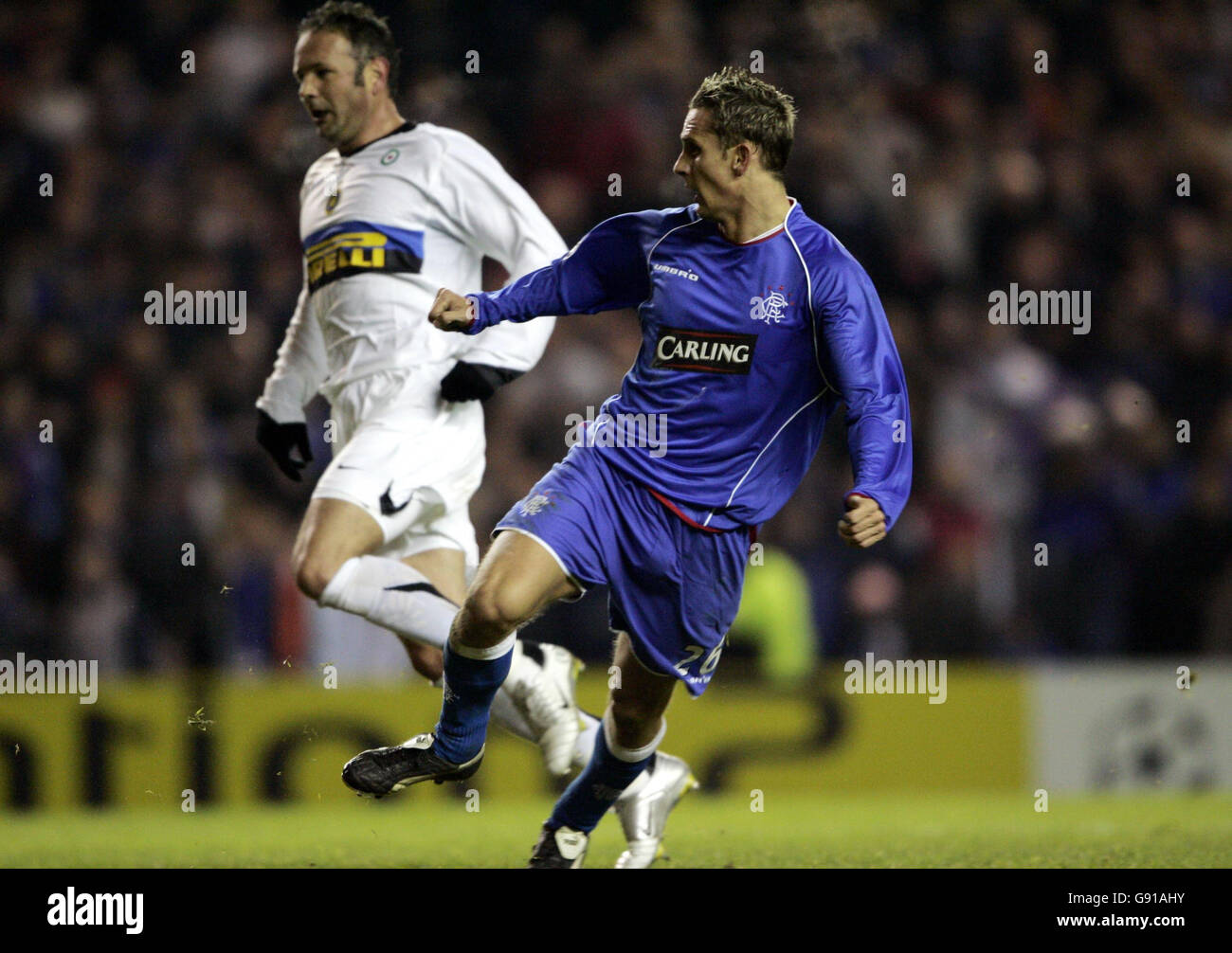 Rangers' Peter Lovenkrands turns to celebrate after scoring against ...