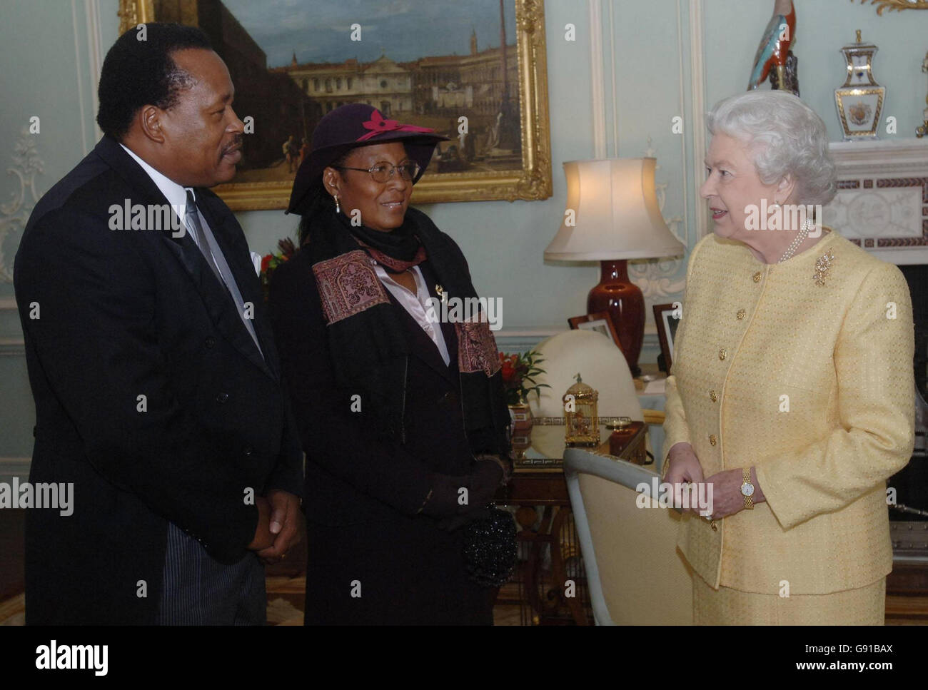 Britain's Queen Elizabeth II (right) greets the High Commissioner for ...