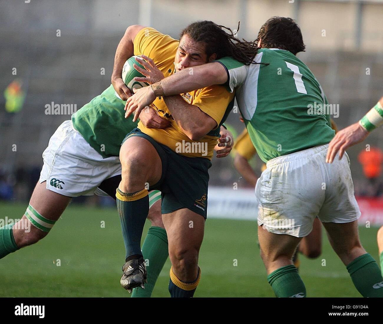 Ireland's Marcus Horan and Denis Leamy tackle Australia's George Smith ...
