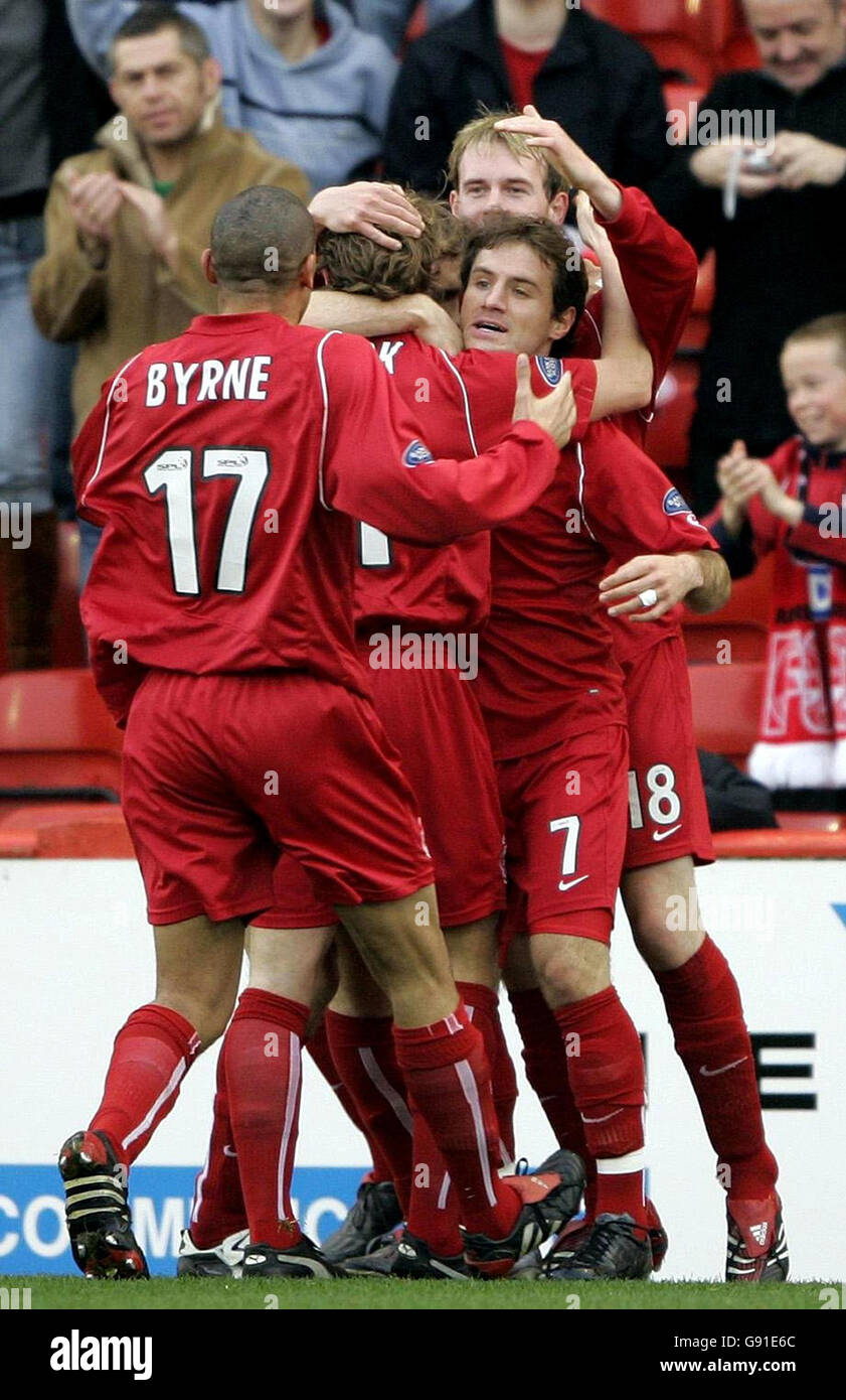 Aberdeen's Jamie Smith (second right) celebrates with team-mates after ...