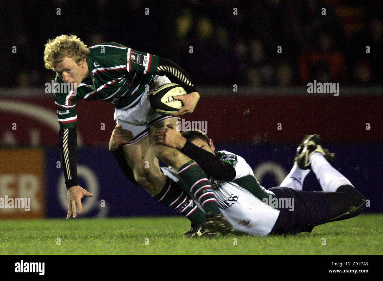 Leicester's Sam Vesty (L) is tackled by London Irish's Scott Staniforth ...