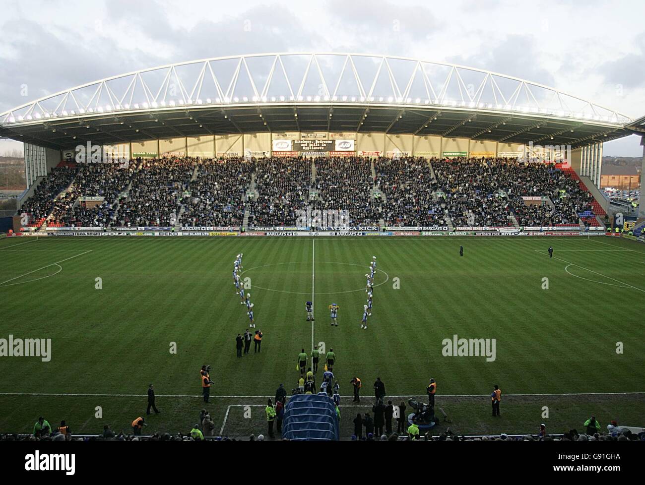 Players and fans observe a minutes silence in honour of George Best who ...