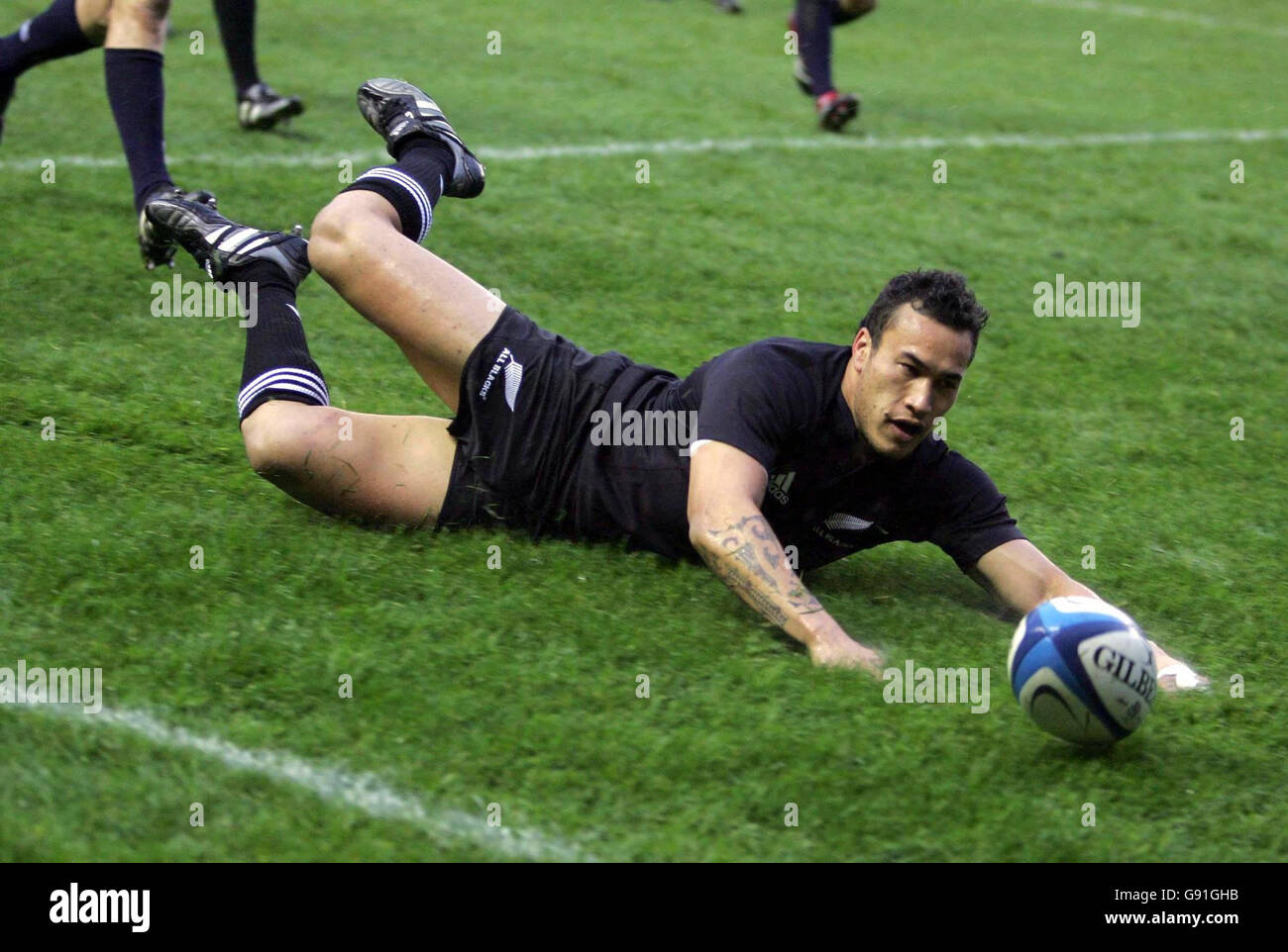 New Zealand's Rico Gear scores a try against Scotland during the ...