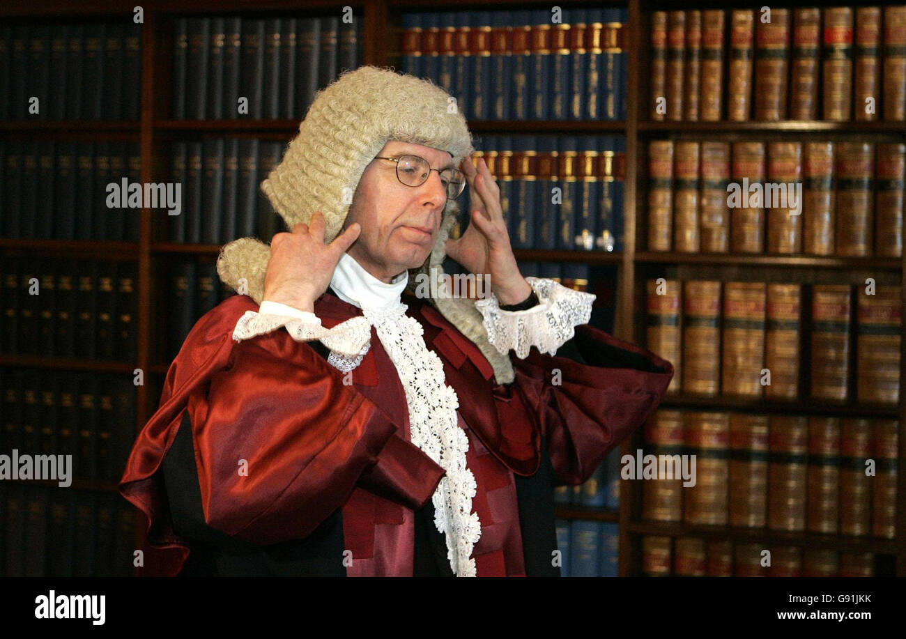 The Rt Hon Lord Hamilton adjusts his civil robes in his office in ...