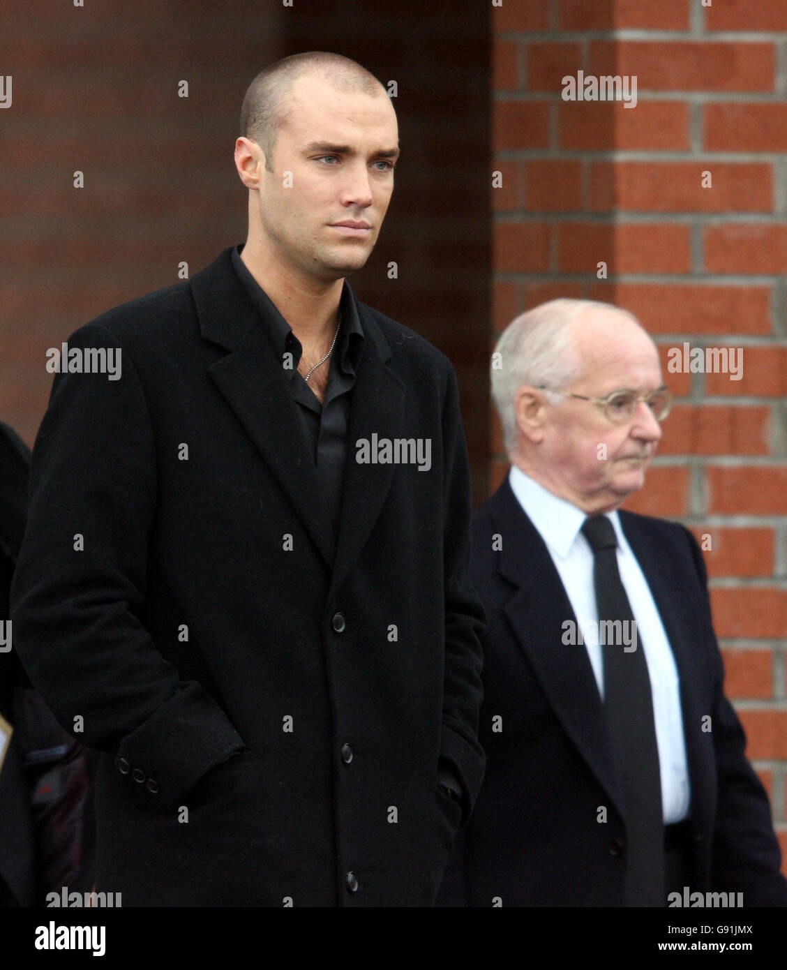 Calum Best (L) with George Bests' father, Dickie Best, walk behind his ...