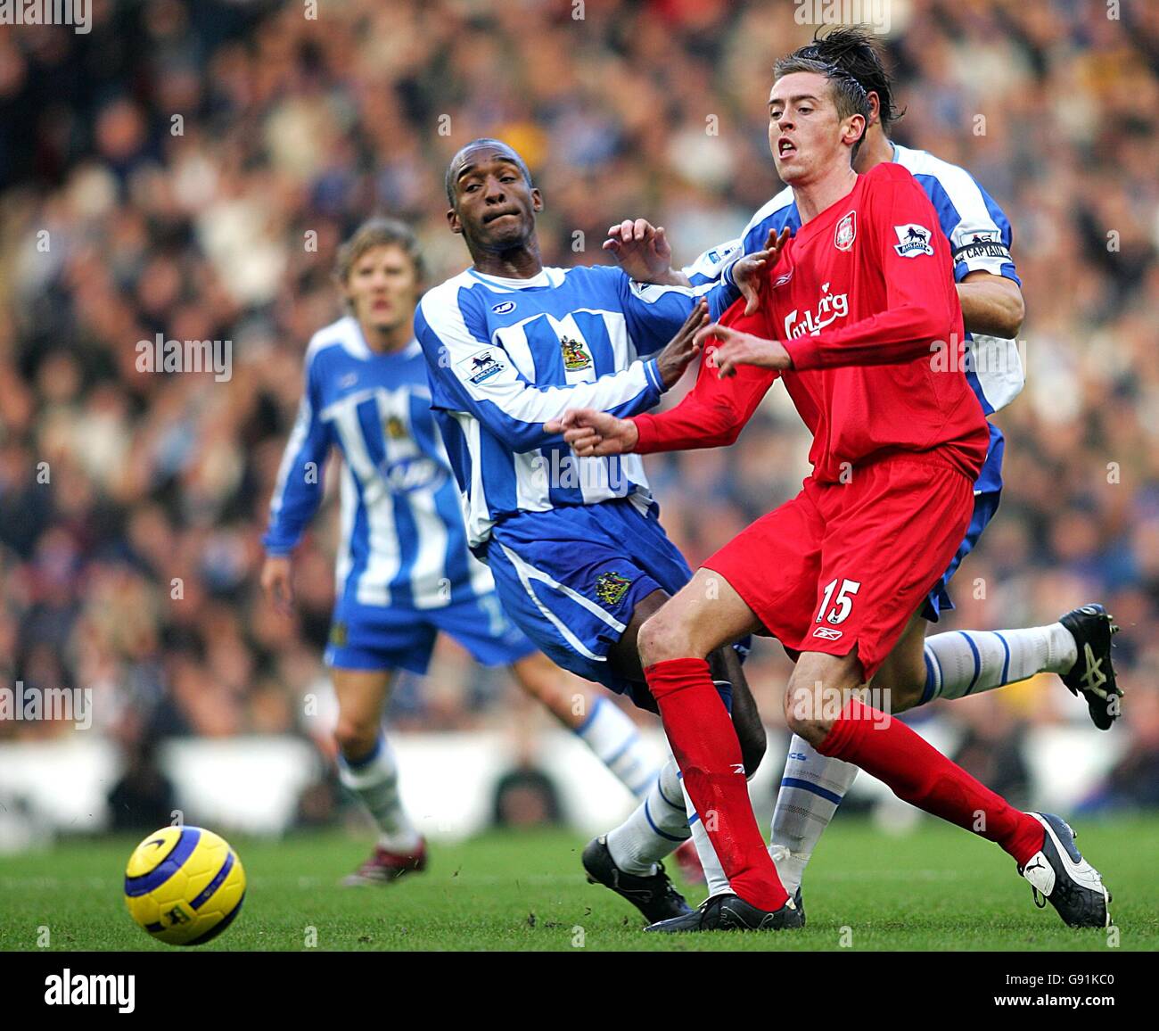 (L-R) Wigan Athletic's Damien Francis and Liverpool's Peter Crouch ...