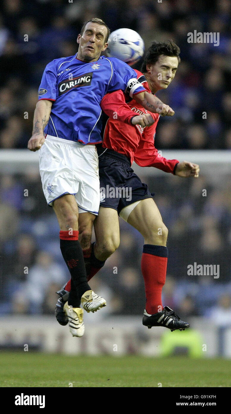 Rangers' Fernando Ricksen (L) challenges Falkirk's Alan Gow during the ...