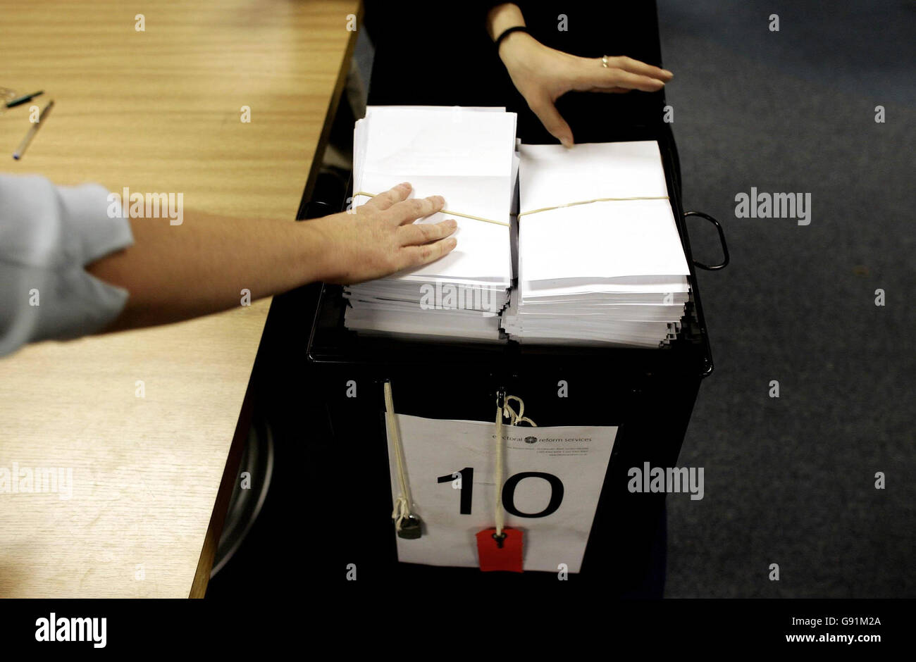 Ballot papers are placed in the number 10 ballot box hi-res stock ...