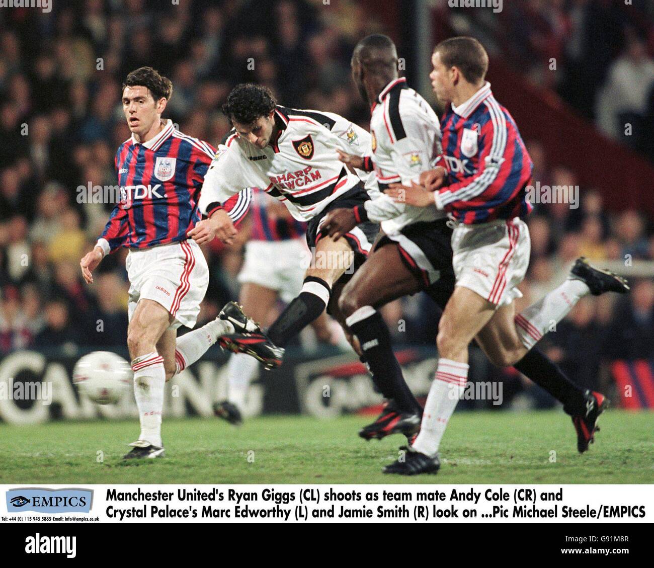 Manchester United's Ryan Giggs (CL) shoots as team mate Andy Cole (CR ...
