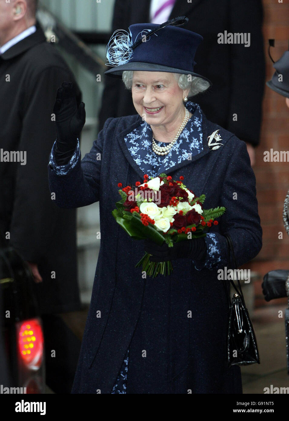 Britain's Queen Elizabeth II waves as she leaves the Belfast Central ...