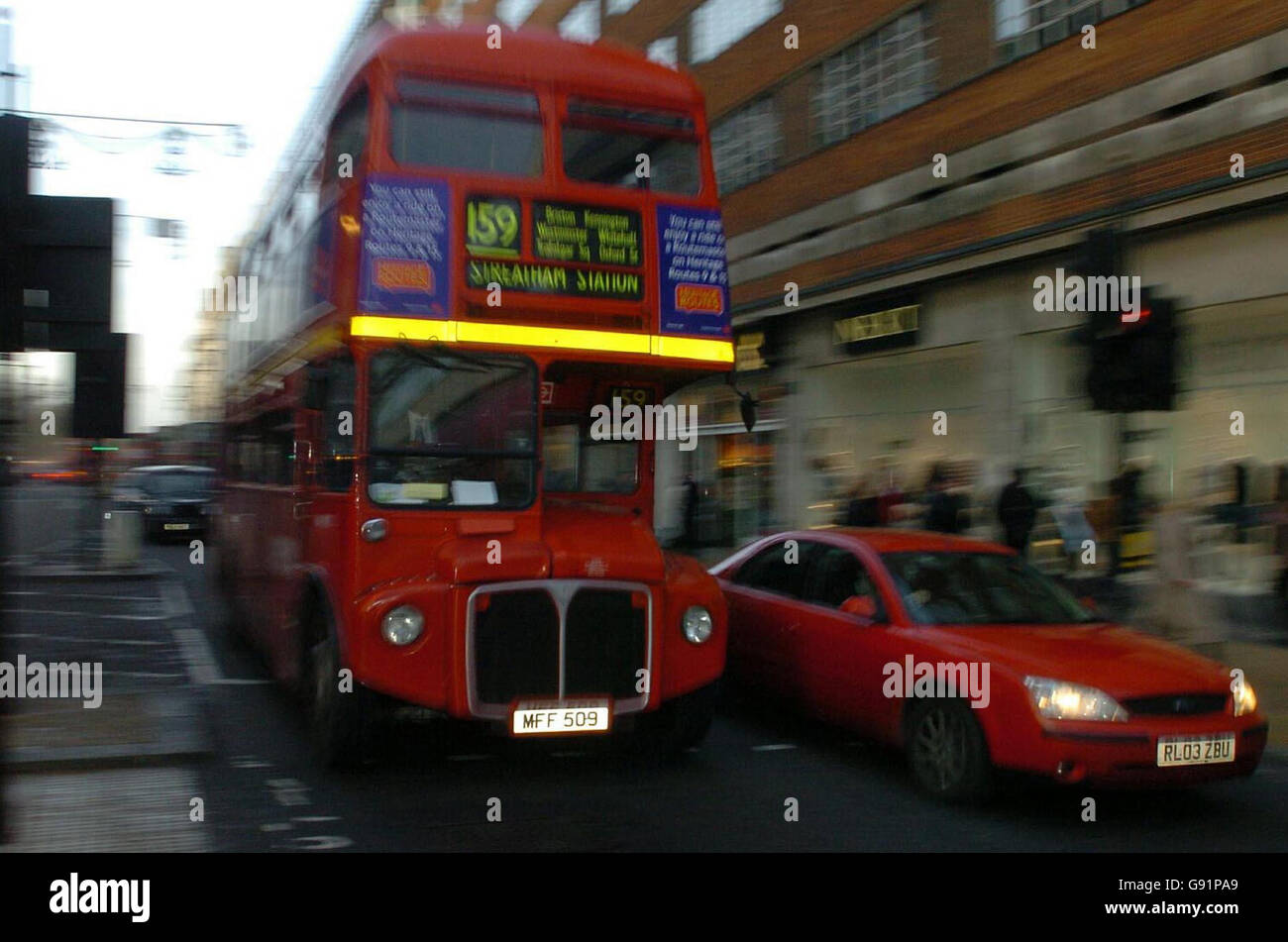 A number 159 Routemaster bus makes its way up London's Oxford Street ...