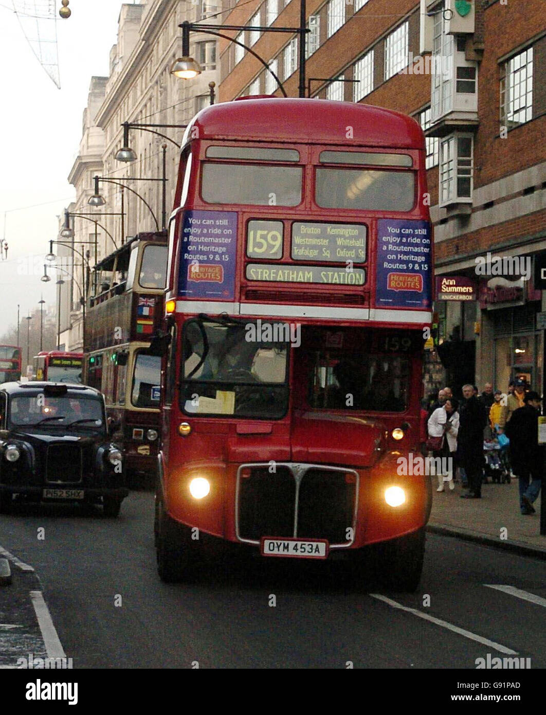 A number 159 Routemaster bus makes its way up London's Oxford Street ...