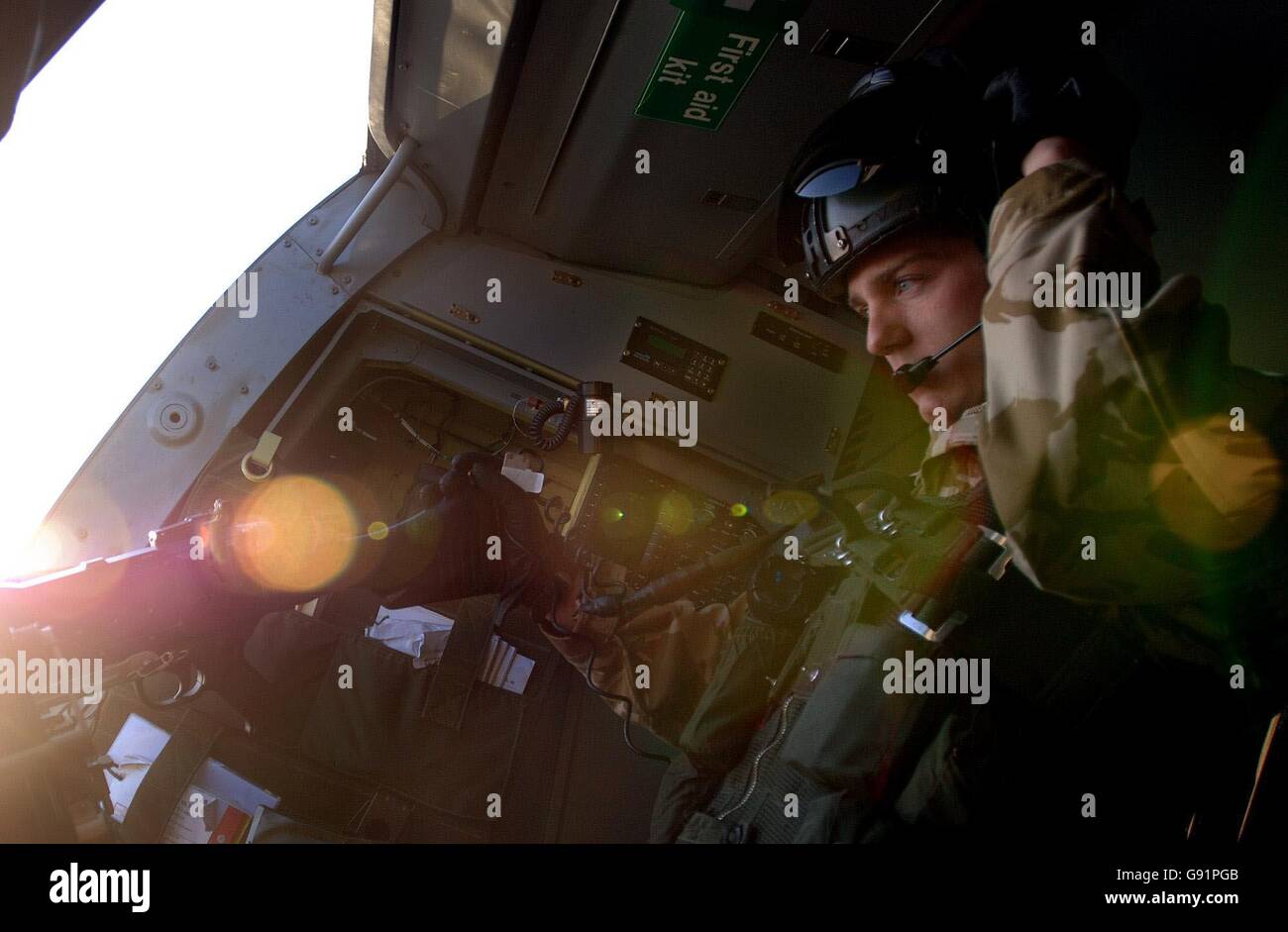 A British RAF door gunner watches for possible insurgency action during ...