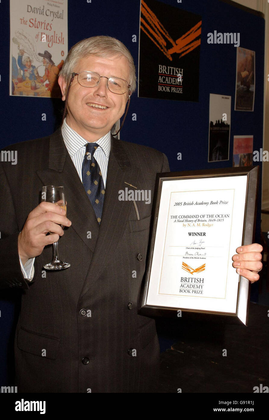Professor N.A.M. Rodger of Exeter University holds his certificate ...