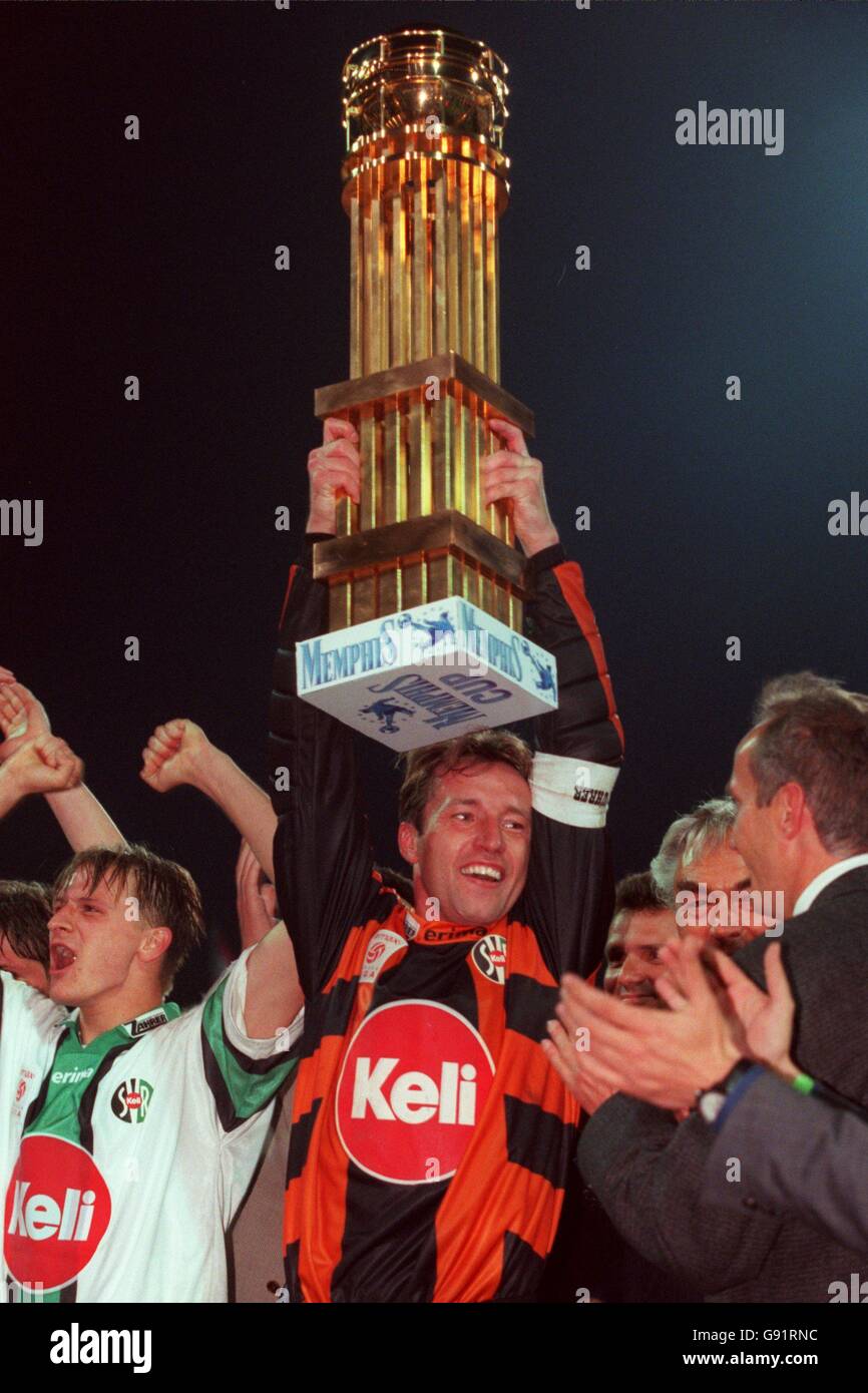 Ronald Unger the SV Keli Ried captain holds up the Memphis Cup Trophy ...