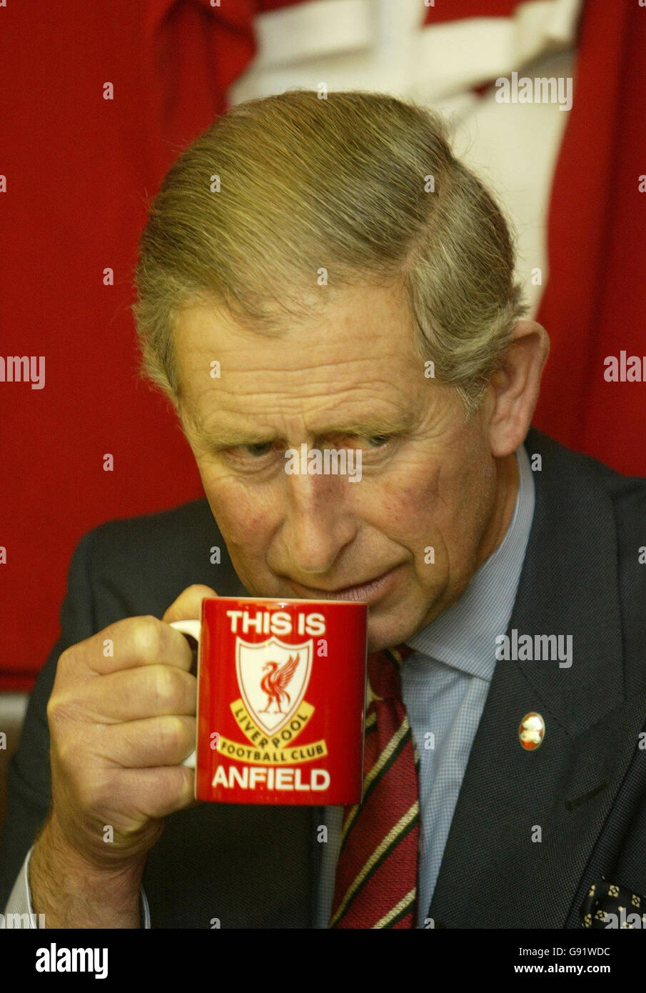 Prince Charles sips Tea from a Liverpool Football club mug whilst ...