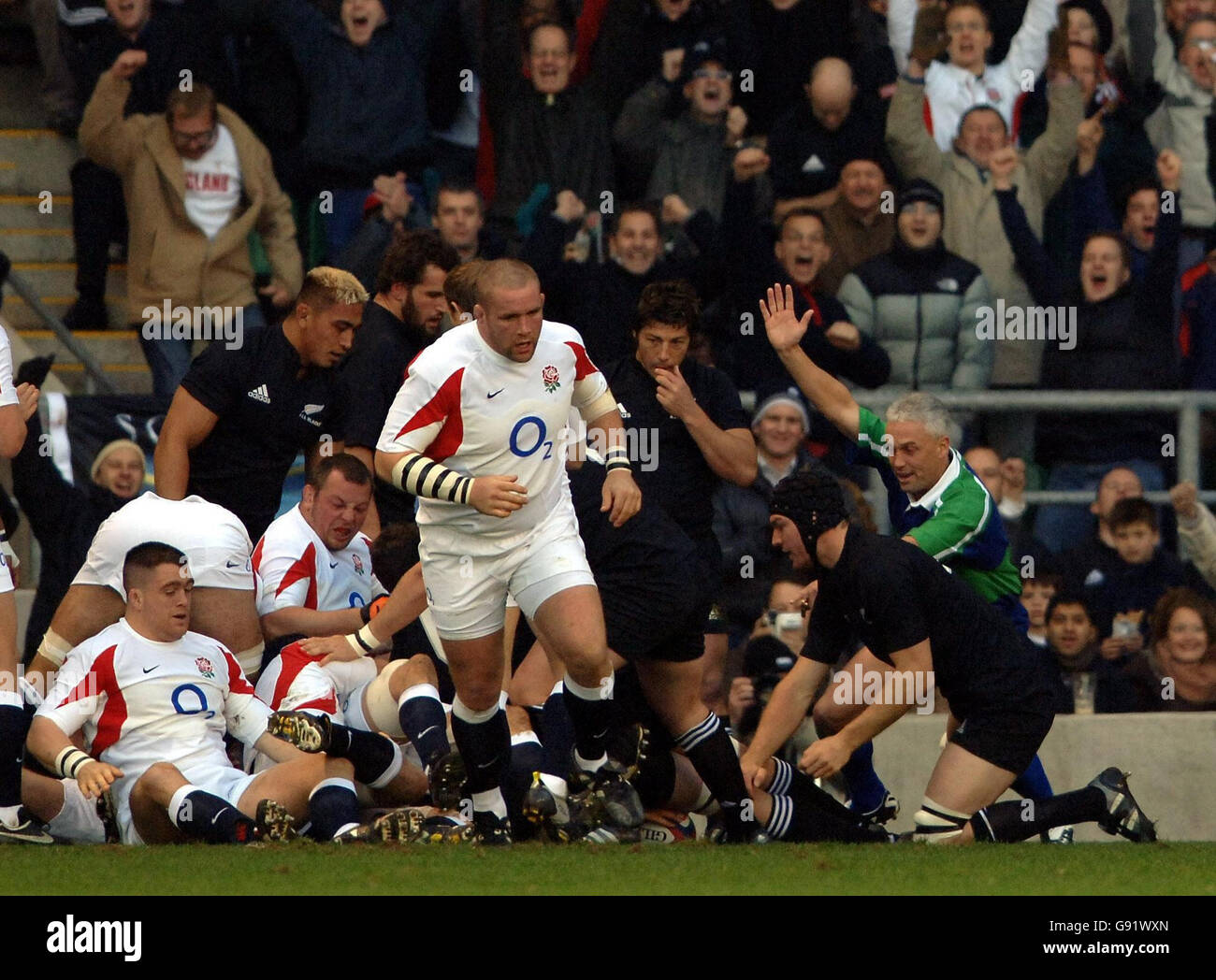 Referee Alan Lewis (R) gives a try to England's Martin Corry (unseen ...