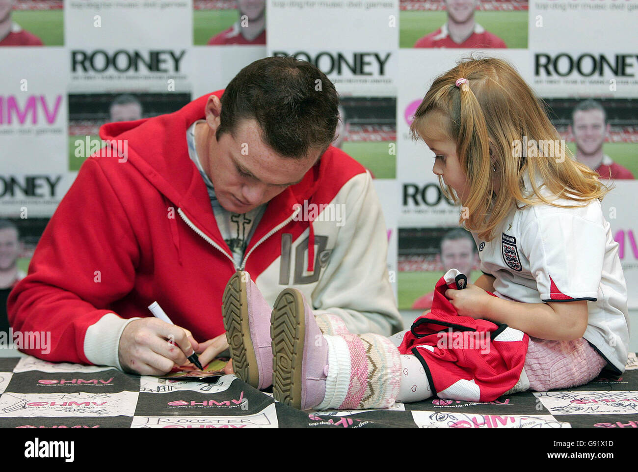 Manchester United's Wayne Rooney with Holly Jackson as he launches his ...