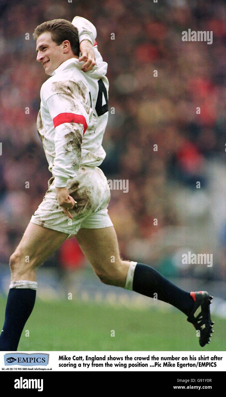 Mike Catt of England shows the crowd the number on his shirt after ...