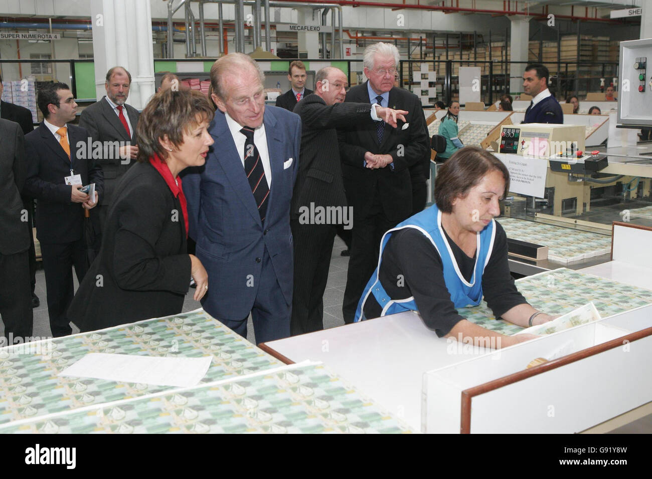 The Duke of Edinburgh is shown sealed bank notes during a visit to a ...