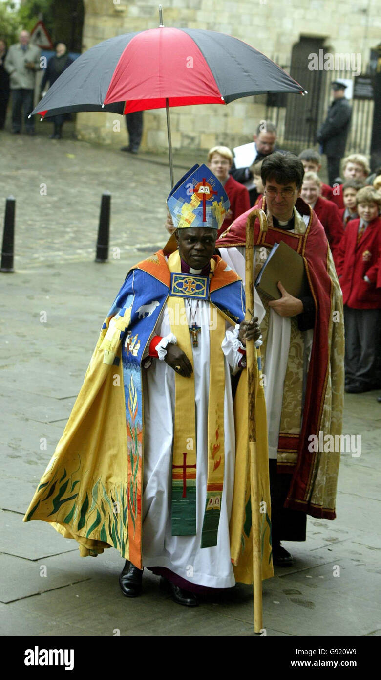 Archbishop John Sentamu, the new Archbishop of York, shelters beneath ...