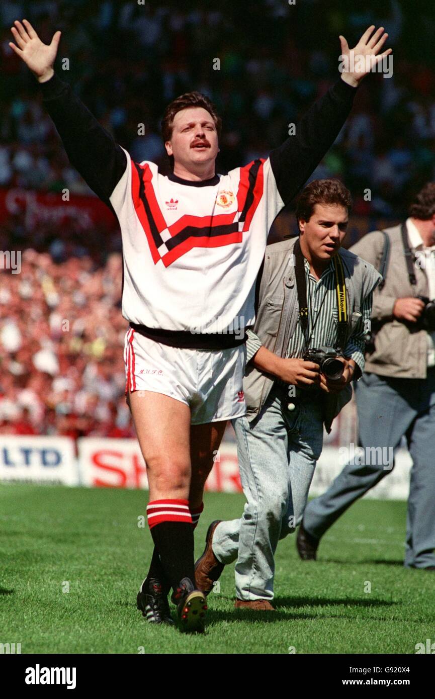 Manchester United director Michael Knighton juggles on the pitch before ...
