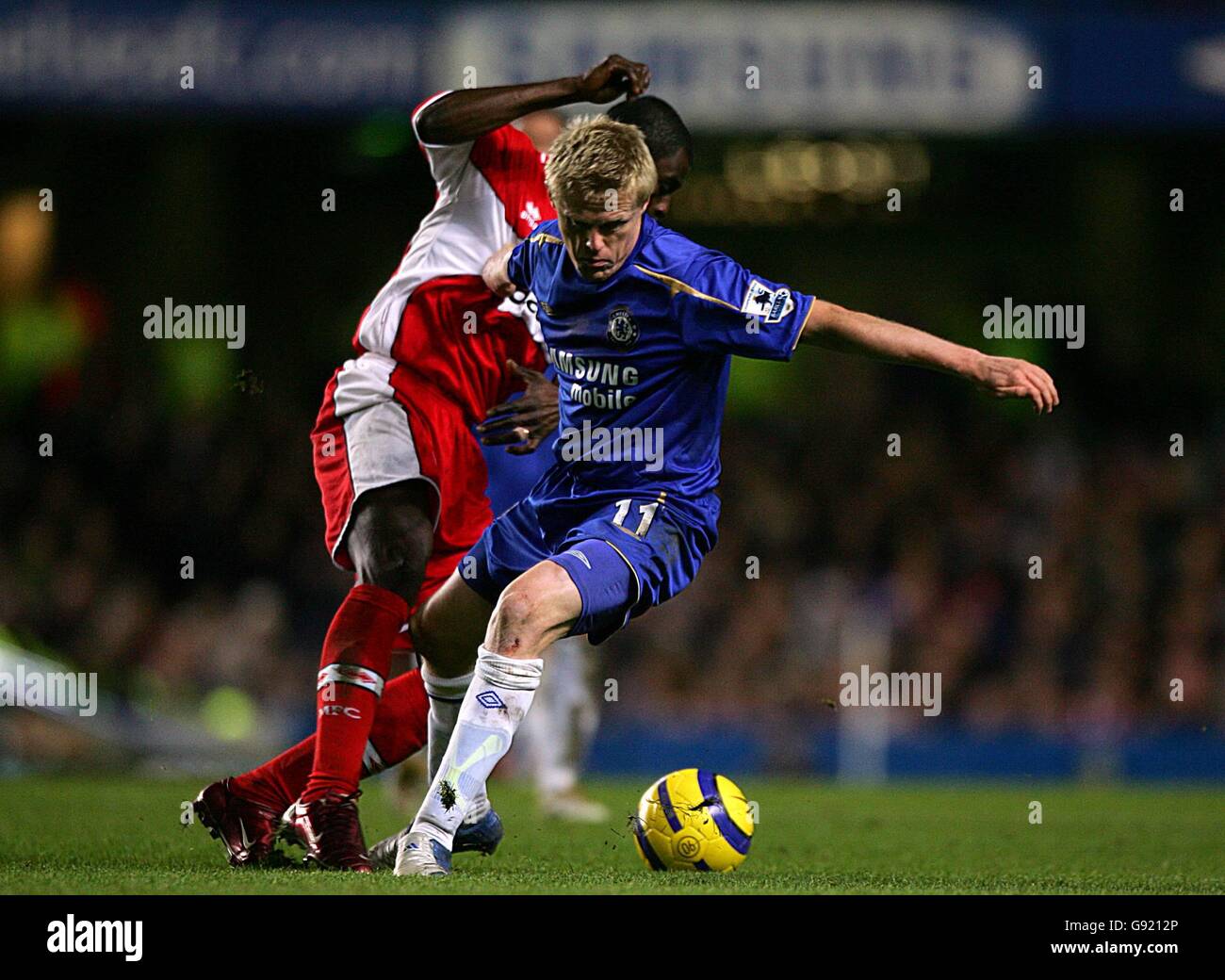 Chelsea's Damien Duff and Middlesbrough's George Boateng battle for the ...