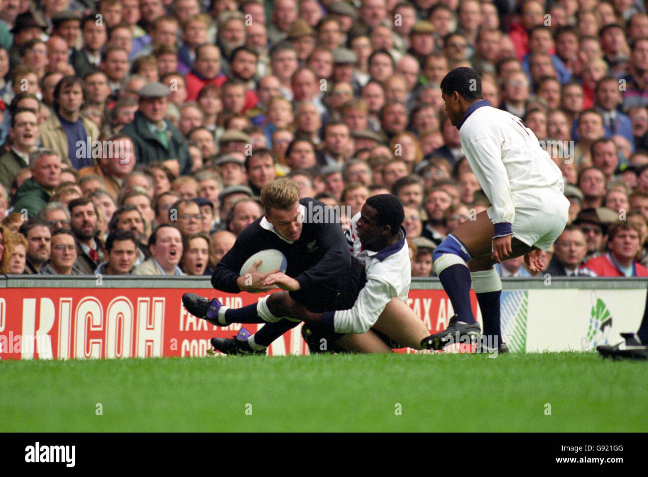 Englands chris oti tackles new zealands john kirwan hi-res stock ...