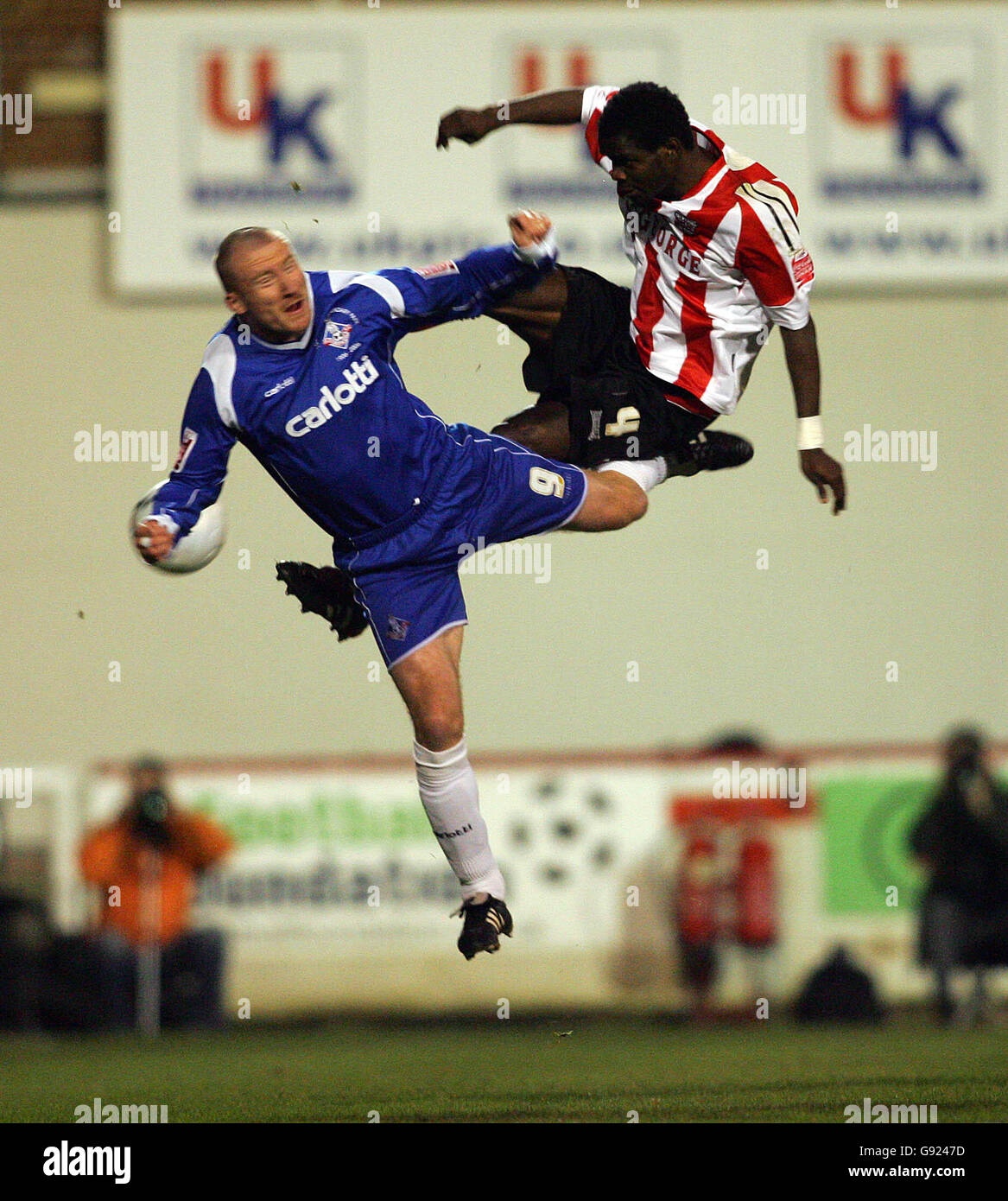 Brentford's Sam Sodje and Oldham Athletic's Luke Beckett battle for the ...