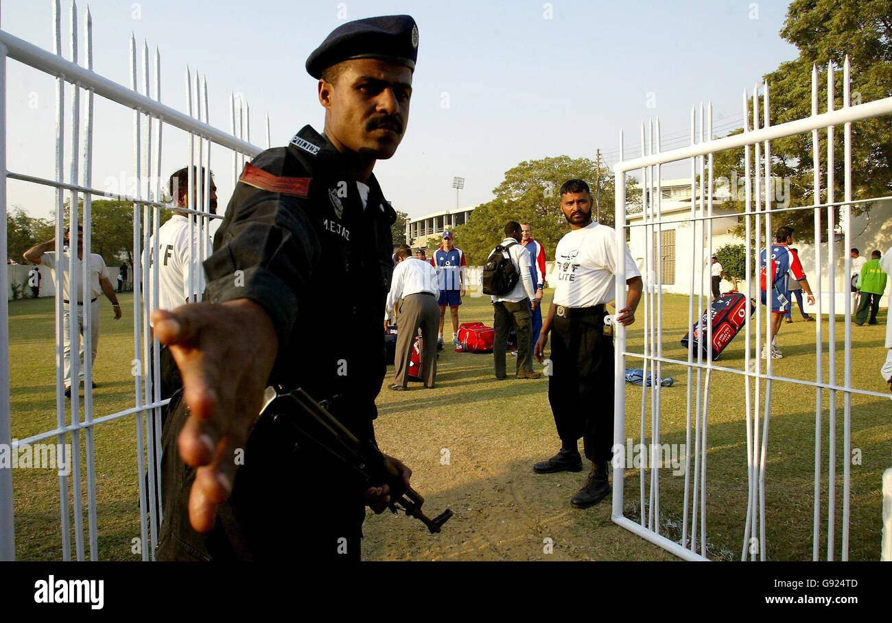A Pakistan police officer guards the gate as the England cricket team ...