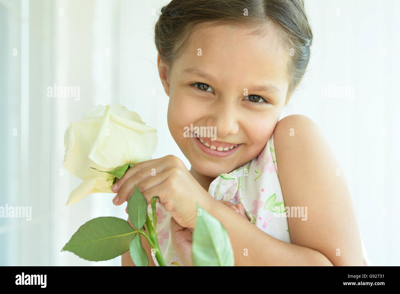 Adorable child holding rose hi-res stock photography and images - Alamy