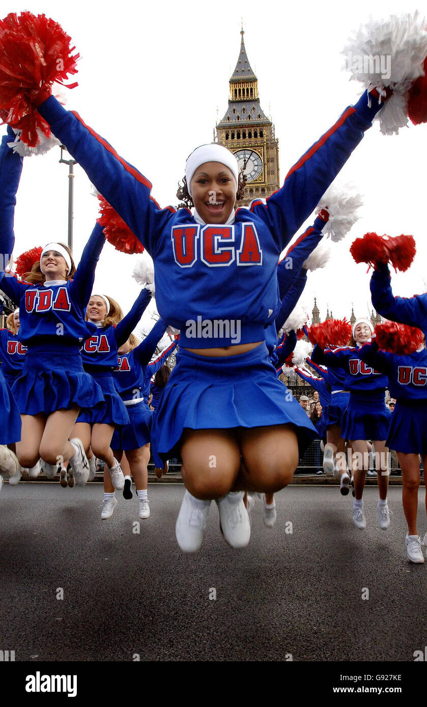 An American cheerleader jumps for joy, as she goes through one of her ...