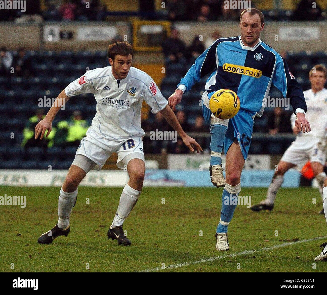 Wycombe's Charlie Griffin (R) keeps the ball from Macclesfield's Andrew ...