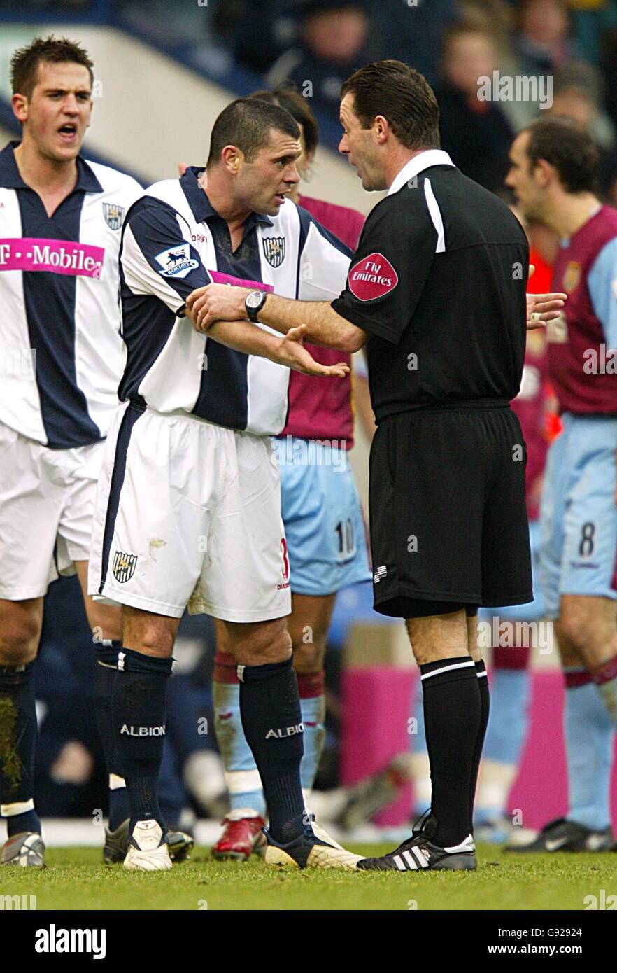 Referee Rob Styles has words with West Bromwich Albion's Paul Robinson ...