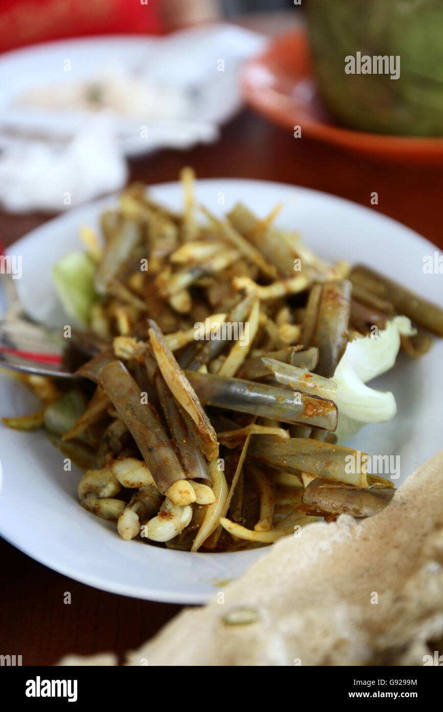 Spicy stir fried Razor Clams with red curry and onion Stock Photo - Alamy
