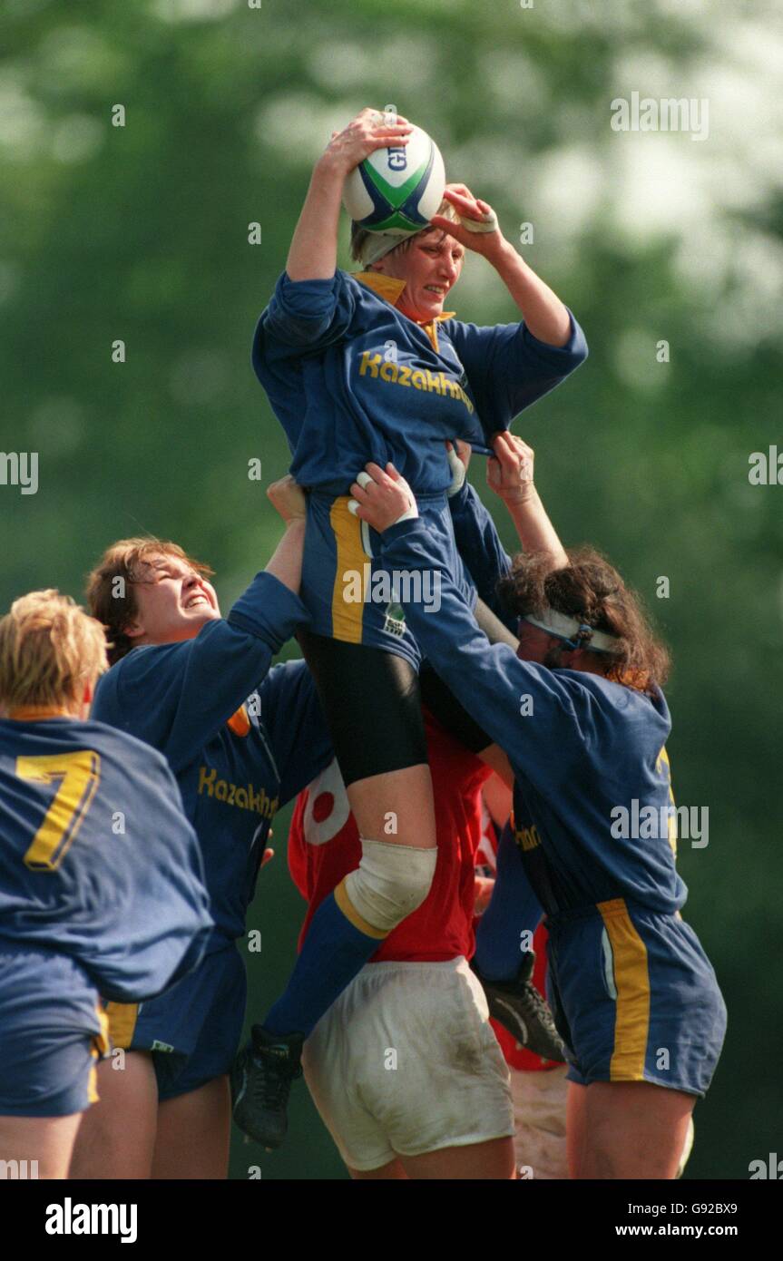 Kazakhstan's Elena Onischenko (top) wins the ball at a line-out, with ...