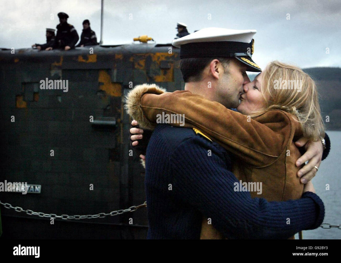Captain of the attack Submarine Spartan Paul Halton is met by his wife ...