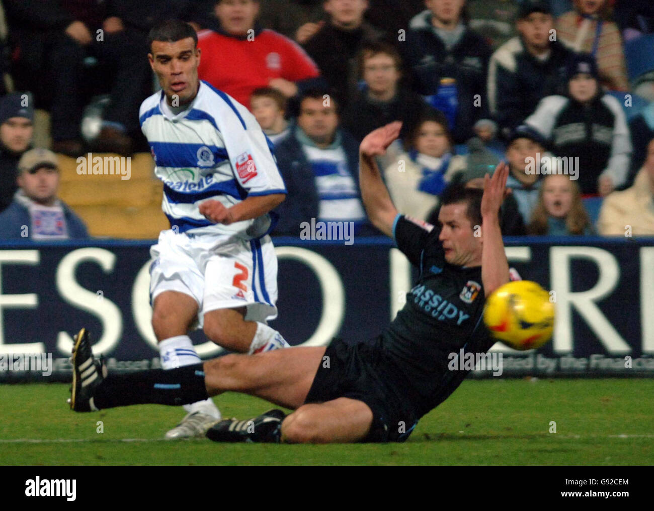 Coventry's Michael Doyle challenges QPR's Marcus Bignot during the Coca ...