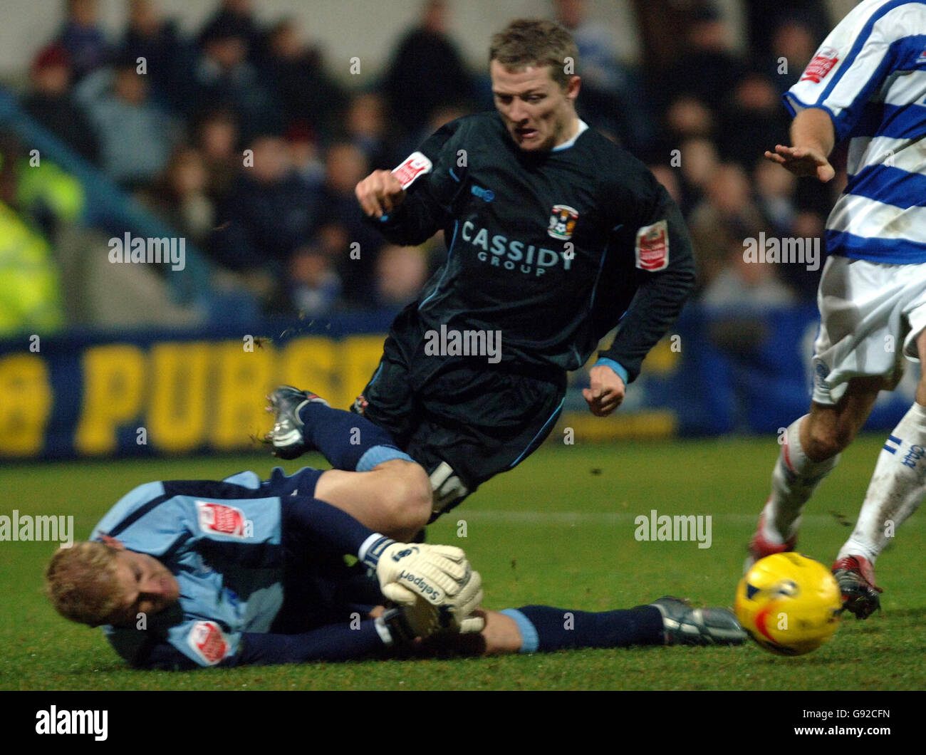 Coventry's Gary McSheffrey is brought down by QPR goalkeeper Simon ...