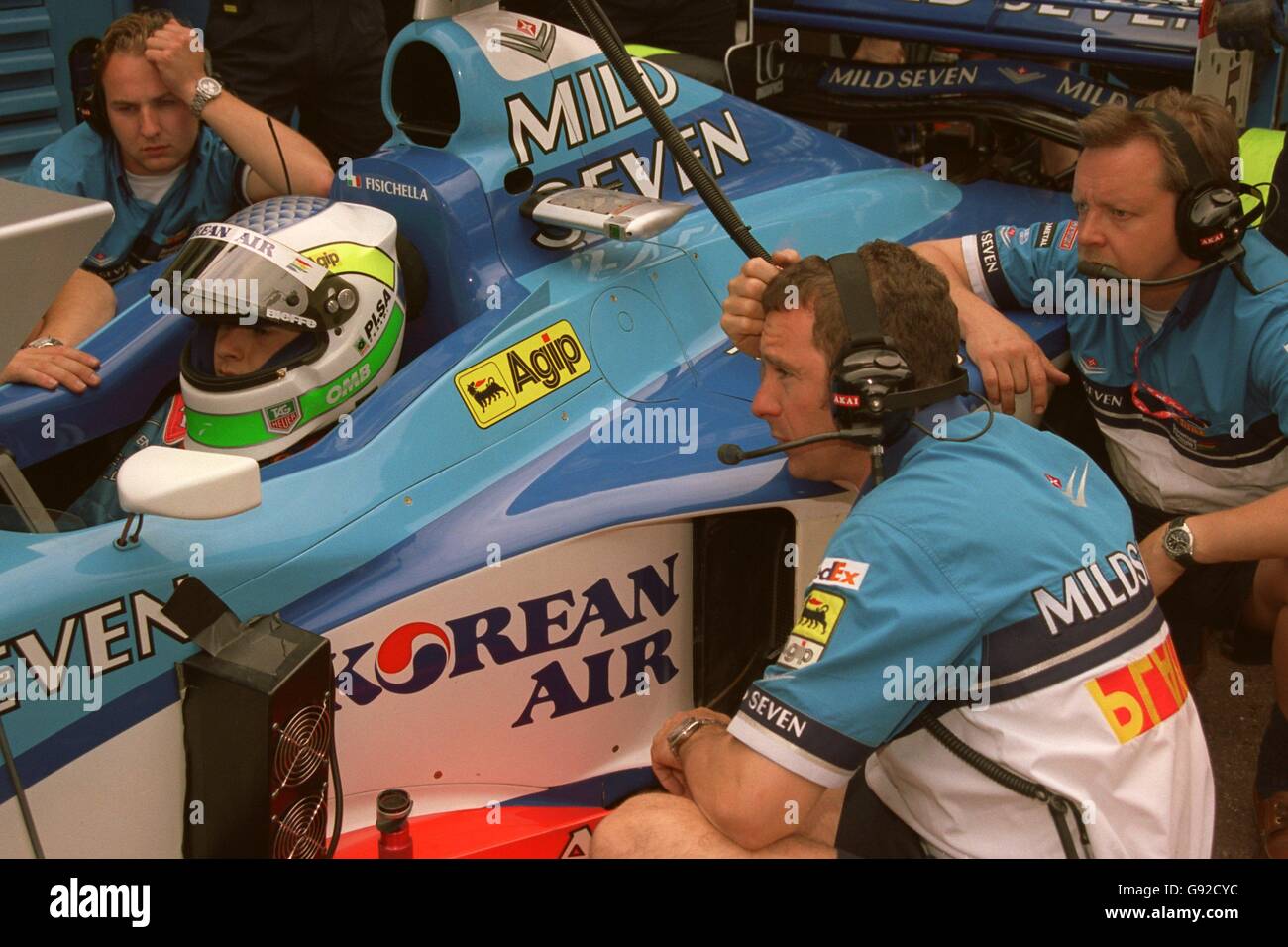 Giancarlo fisichella and his mechanics watch the times during ...