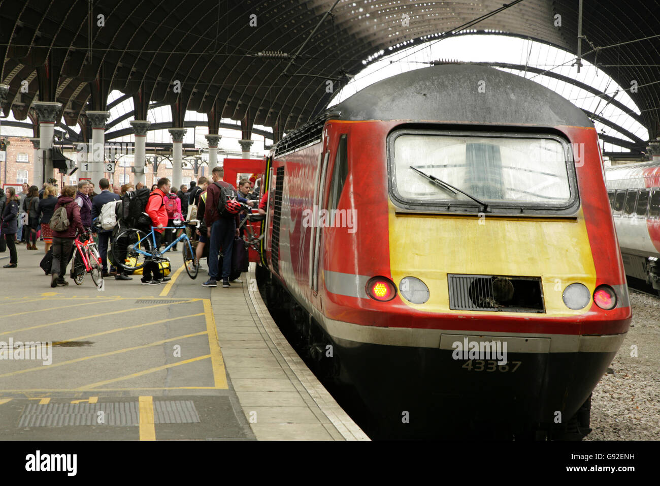Passengers loading bicycles into Virgin Trains East Coast High Speed ...