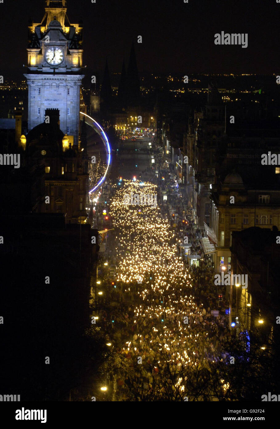 A torchlight procession weaving through Edinburgh's historic heart ...