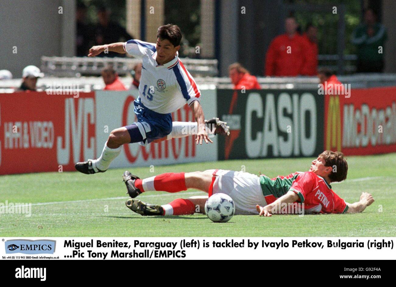 Miguel Benitez of Paraguay (left) is tackled by Ivaylo Petkov of ...
